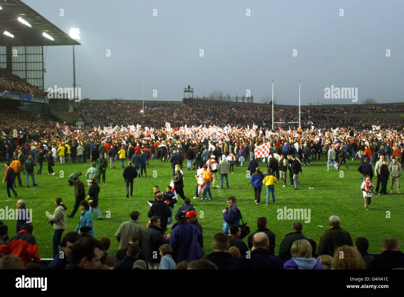 Ulster fans invade pitch: Cup win Stock Photo - Alamy
