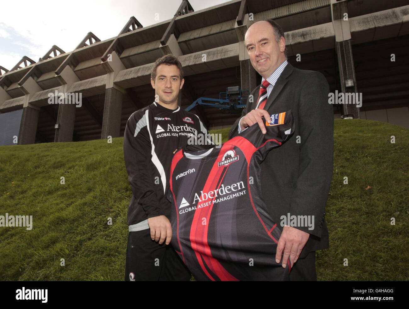 Edinburgh Captain Greig Laidlaw holds up his shirt after signing a two ...