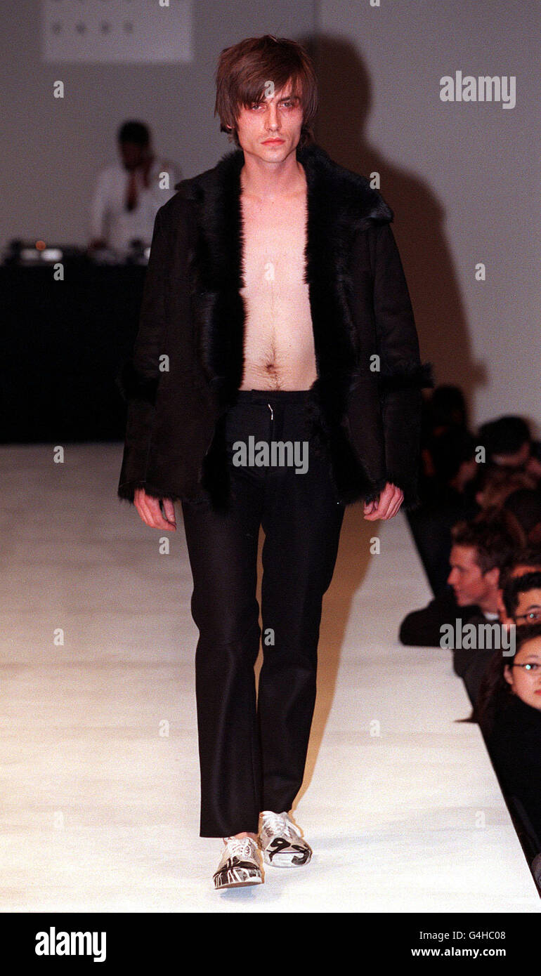 Model presents black jacket trousers designed by warren kade hi-res ...