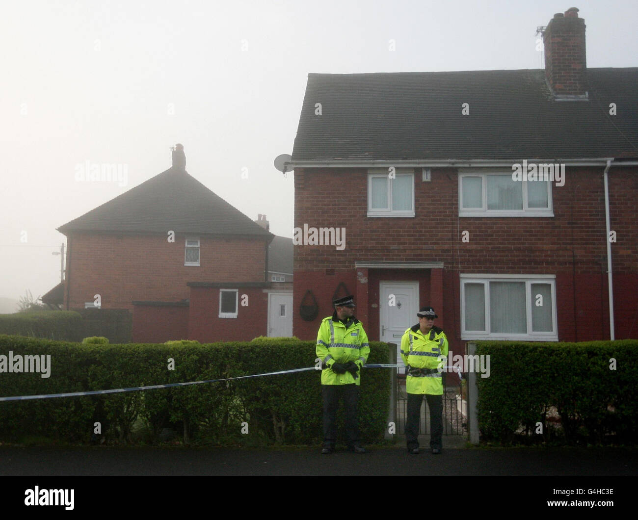 Police officers stand outside house in preston hi-res stock photography ...