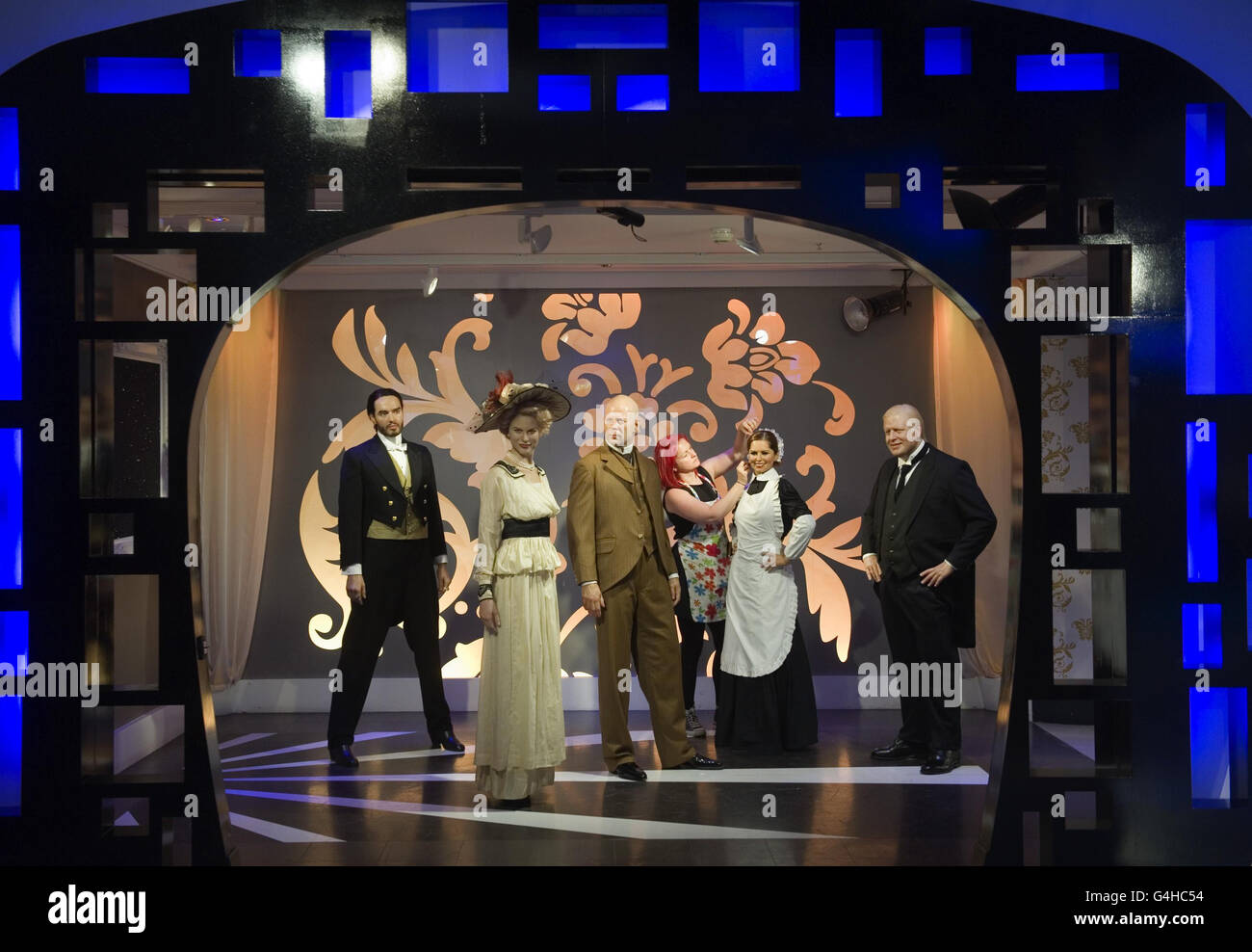 Wardrobe supervisor Jane Anderson makes final alterations to the wax ...