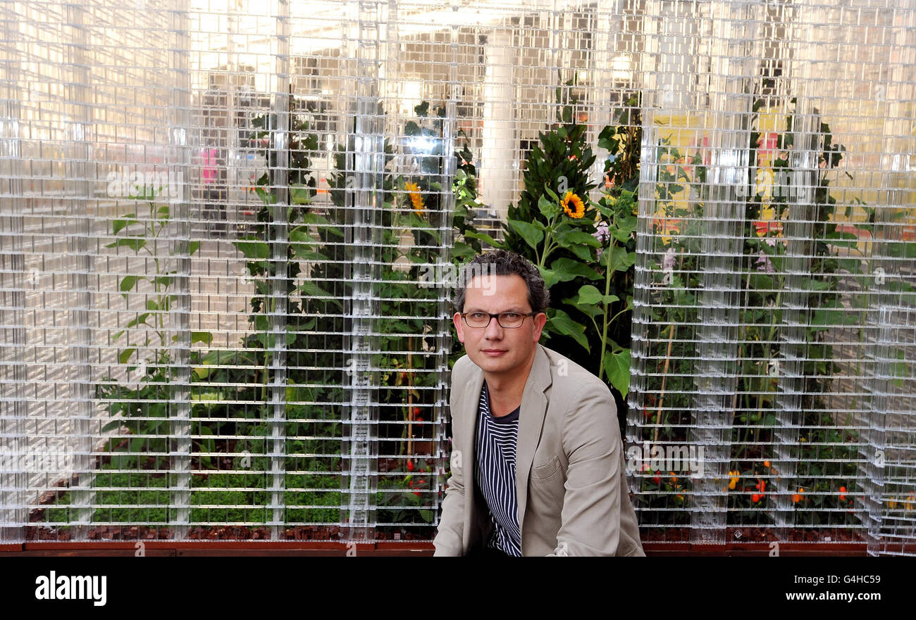 Award winning designer Sebastian Bergne kneels in front of his fully ...
