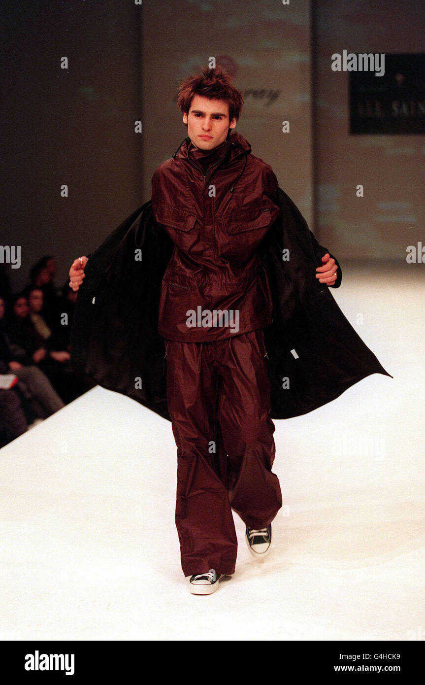 A model wears a futuristic brown jacket and matching trousers designed ...
