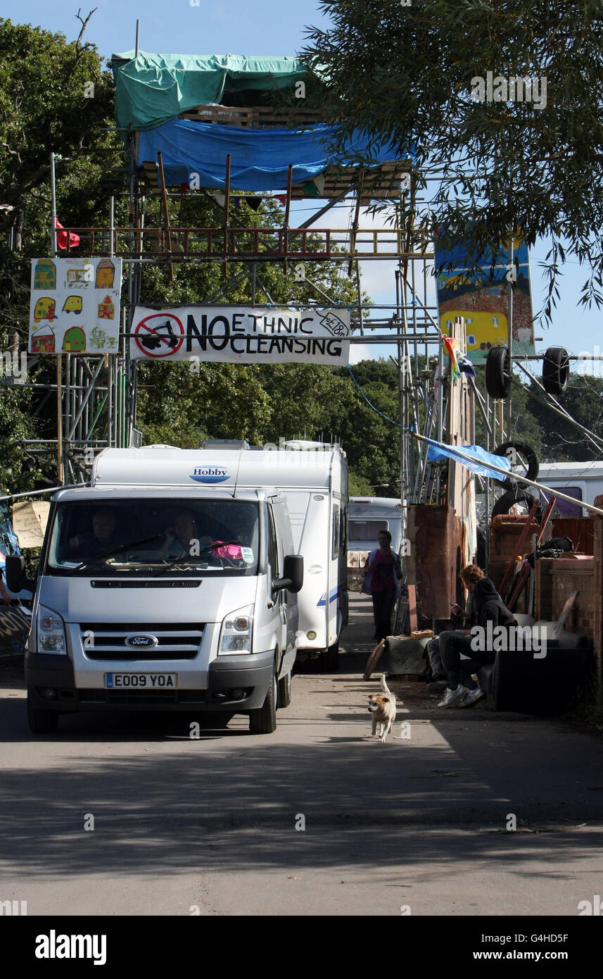 A caravan leaves the Dale Farm travellers site as bailiffs from ...