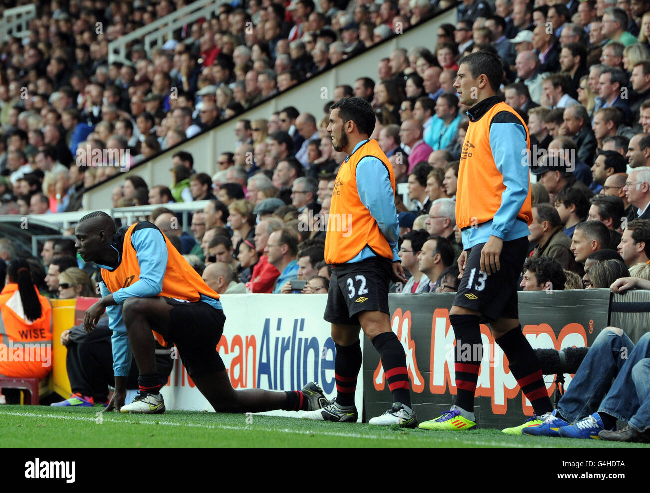 Manchester City's substitutes Mario Balotelli, Carlos Tevez and Adam ...