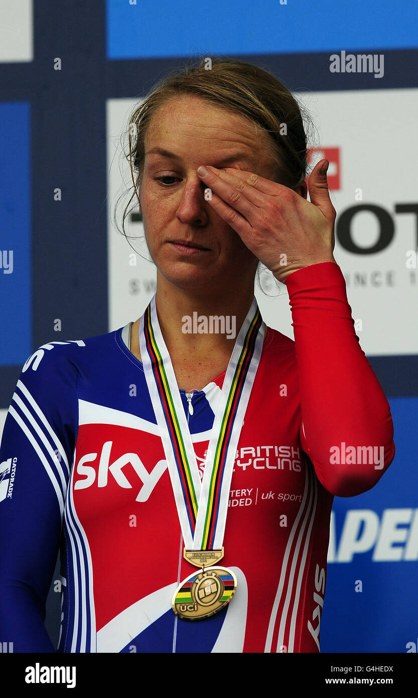 Great Britain's Emma Pooley wipes her face as she accepts bronze medal ...