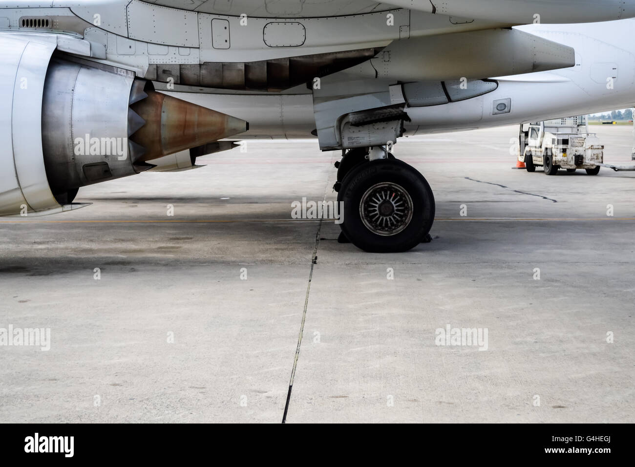 under airplane wing and back of engine at the airport Stock Photo - Alamy