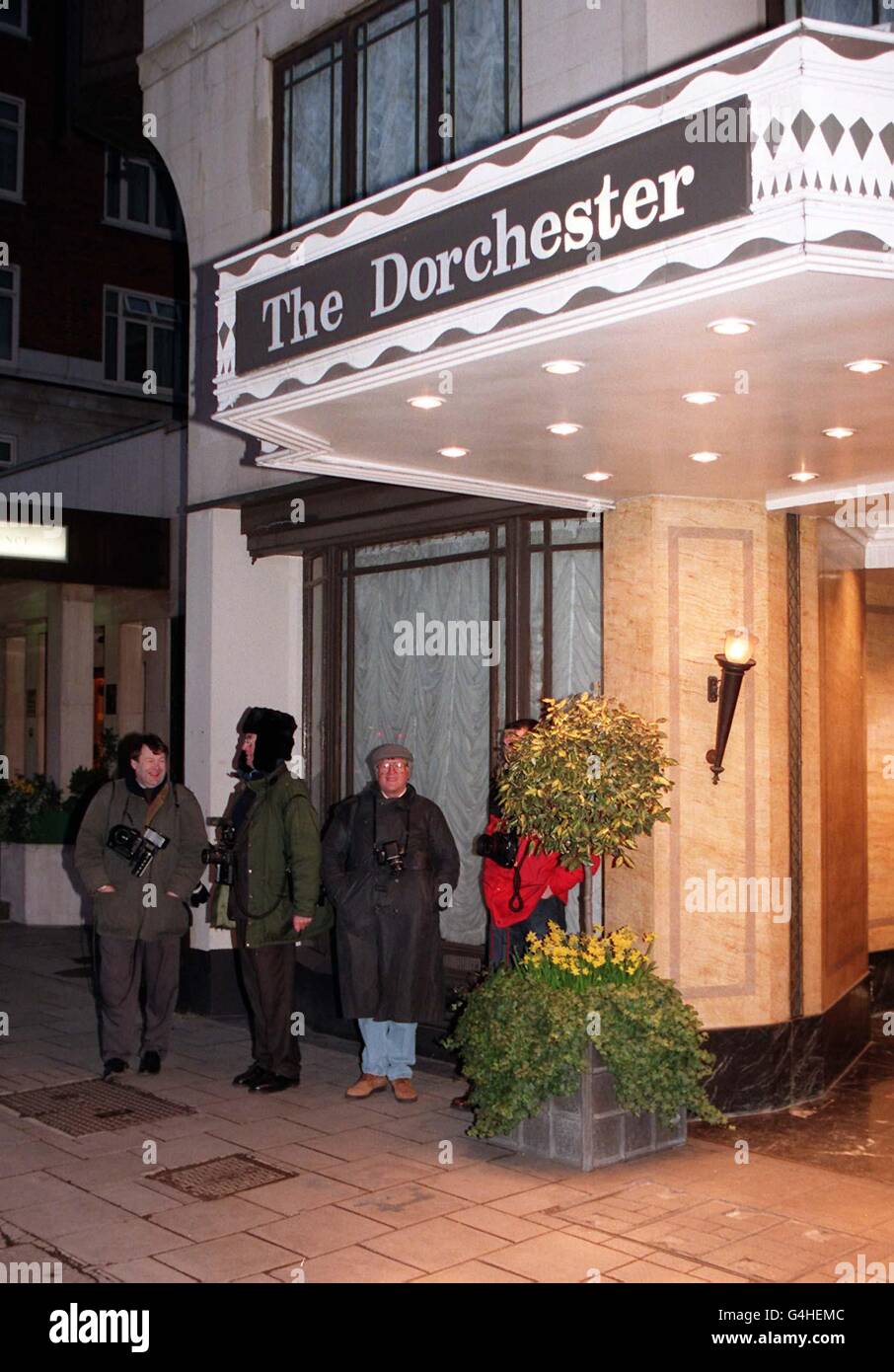 Members of the media stand outside at London's Dorchester Hotel where ...