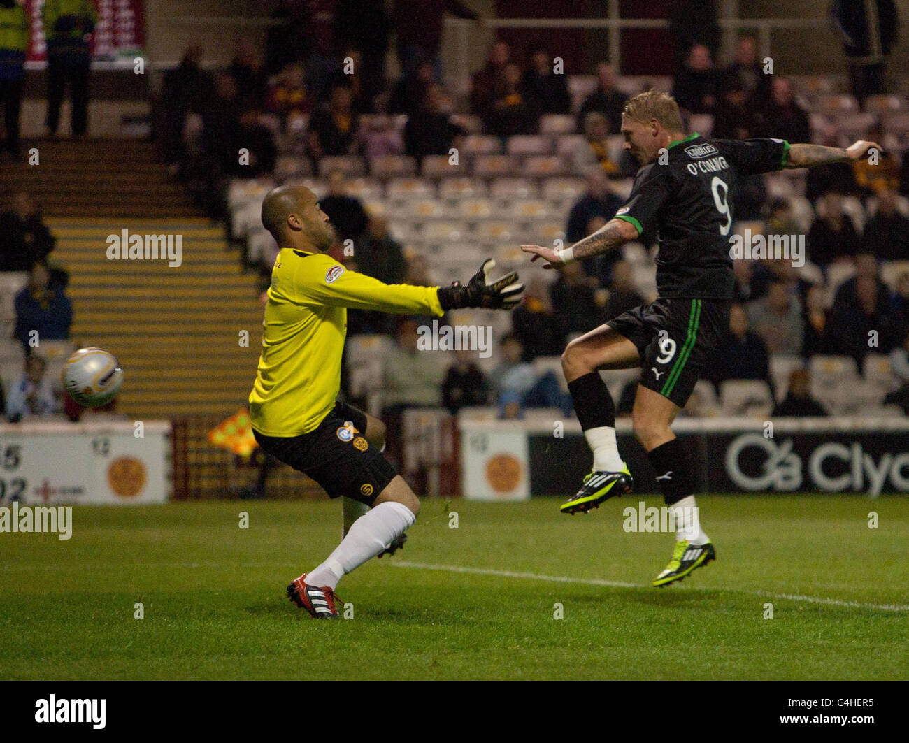 Hibernian's Garry O'Connor drives the ball past Motherwell's Darren ...