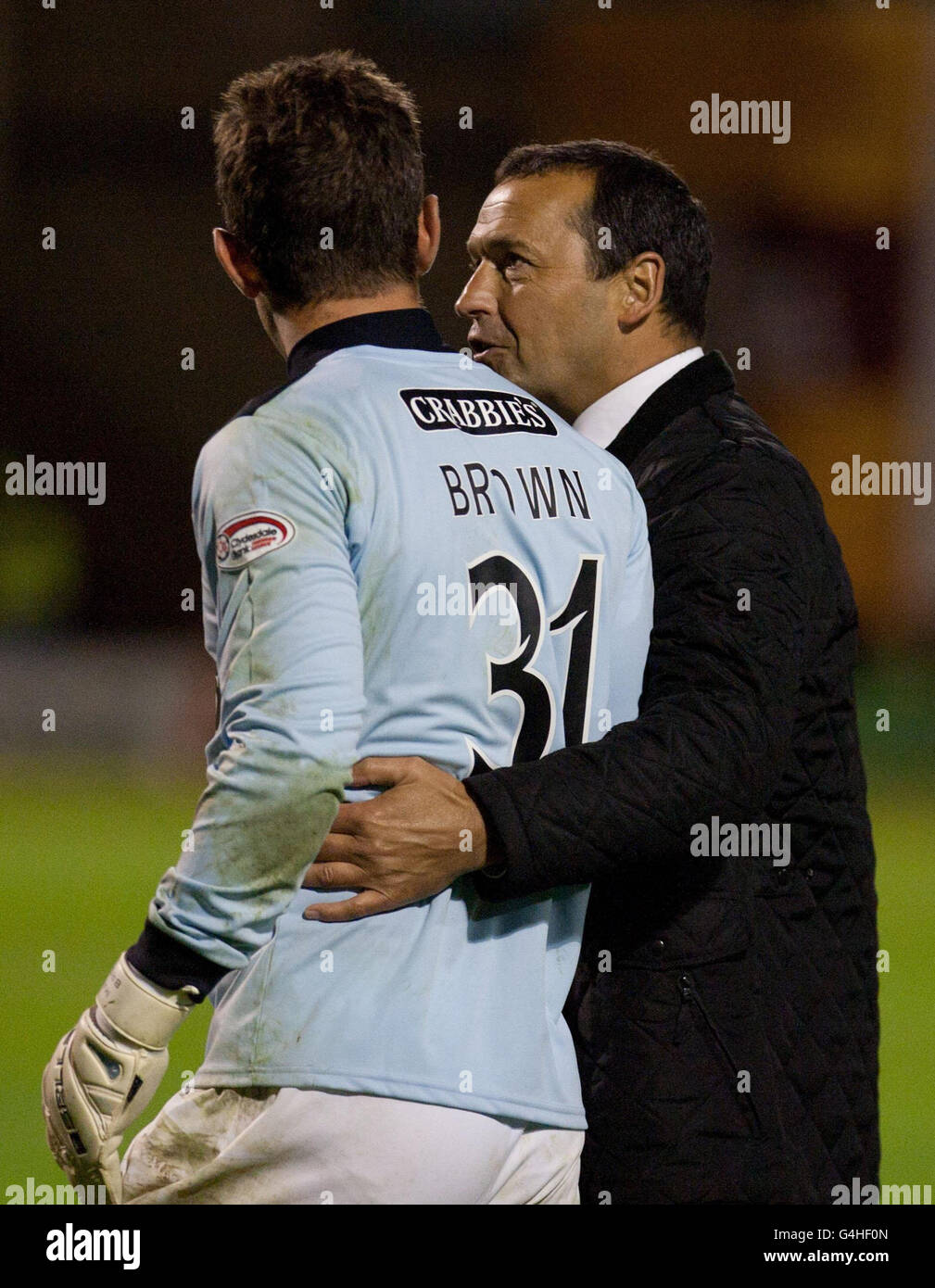Hibernian manager Colin Calderwood with goalkeeper Mark Brown as they ...