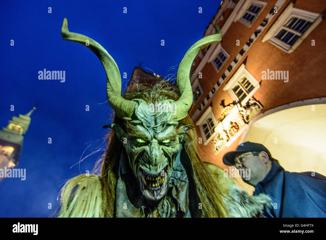 mask procession Perchtenlauf with Krampus at square Hauptplatz, house ...