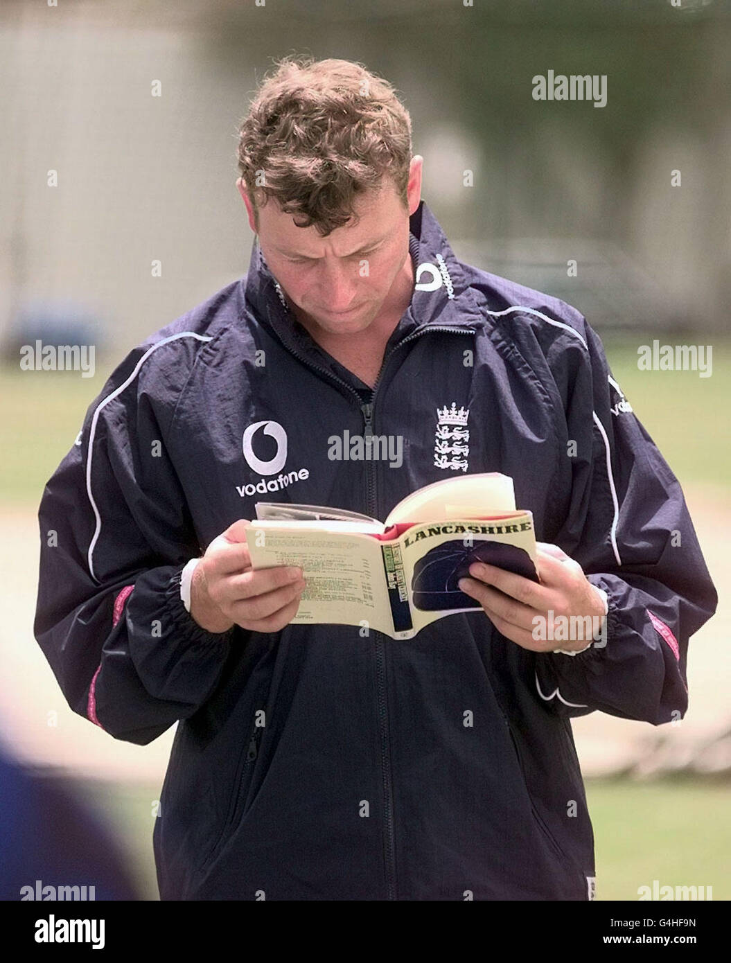 England cricketer Michael Atherton appears focused on a book about ...