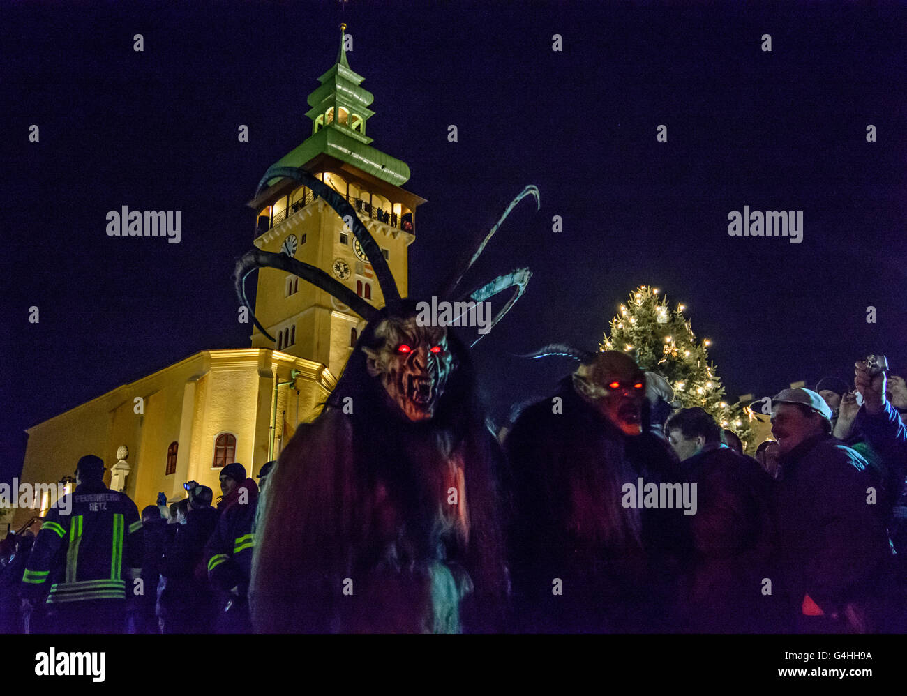 mask procession Perchtenlauf with Krampus at square Hauptplatz, town ...