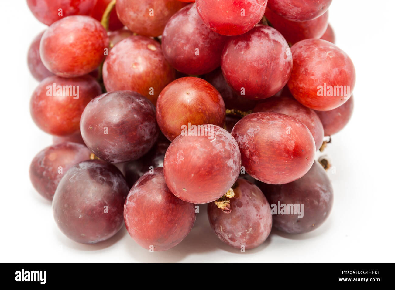 Big red grapes isolated in white background Stock Photo - Alamy
