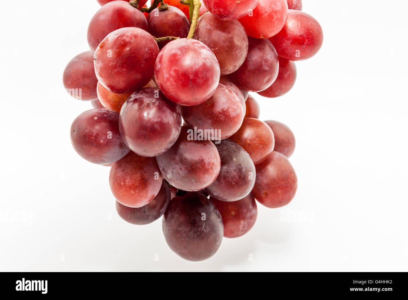 Big red grapes isolated in white background Stock Photo - Alamy