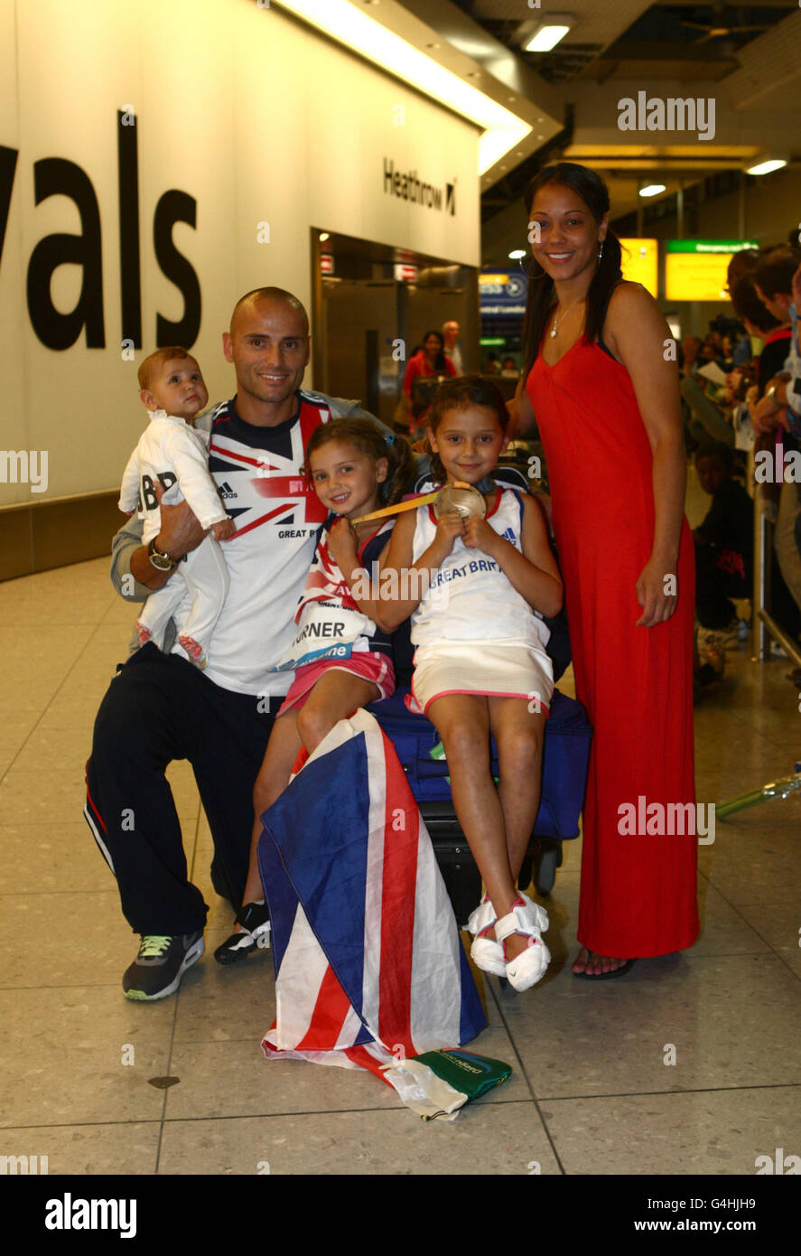 Great Britain's Andy Turner with his family wife Gayner (right) and ...