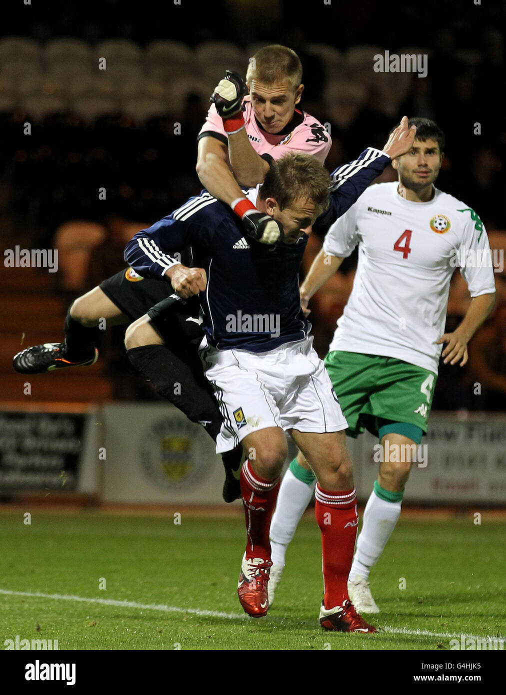 Scotland Jordan Rhodes is caught in face by Bulgaria goalkeeper Plamen ...