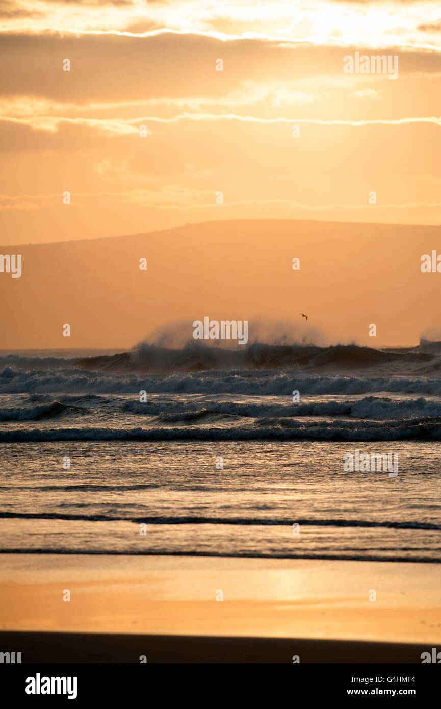 Waves at sunset Stock Photo - Alamy