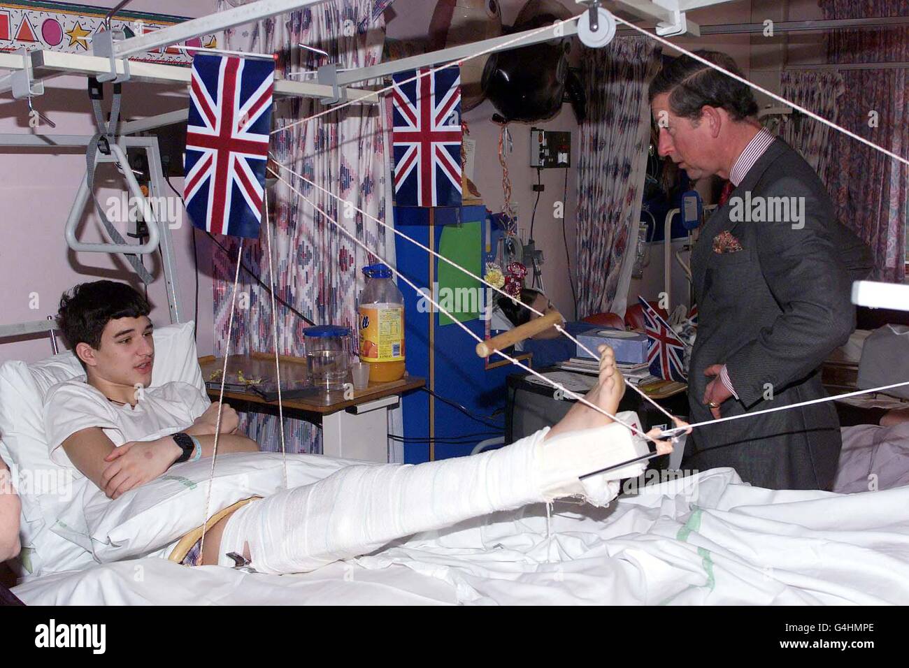The Prince of Wales talks to a young patient, during his visit to the ...