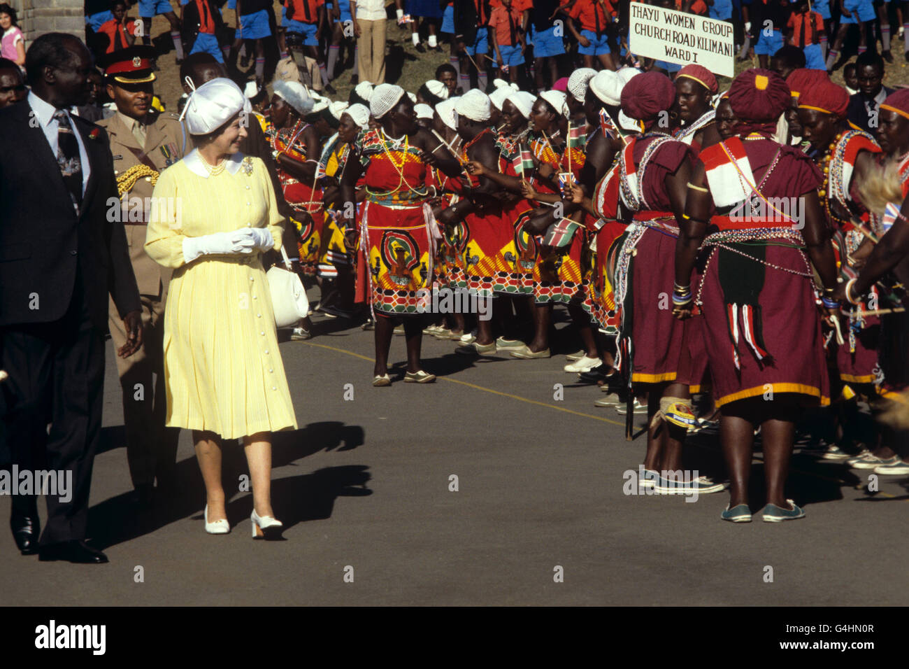 Queen Elizabeth II, with Kenyan President Daniel Arap Moi, is greeted ...