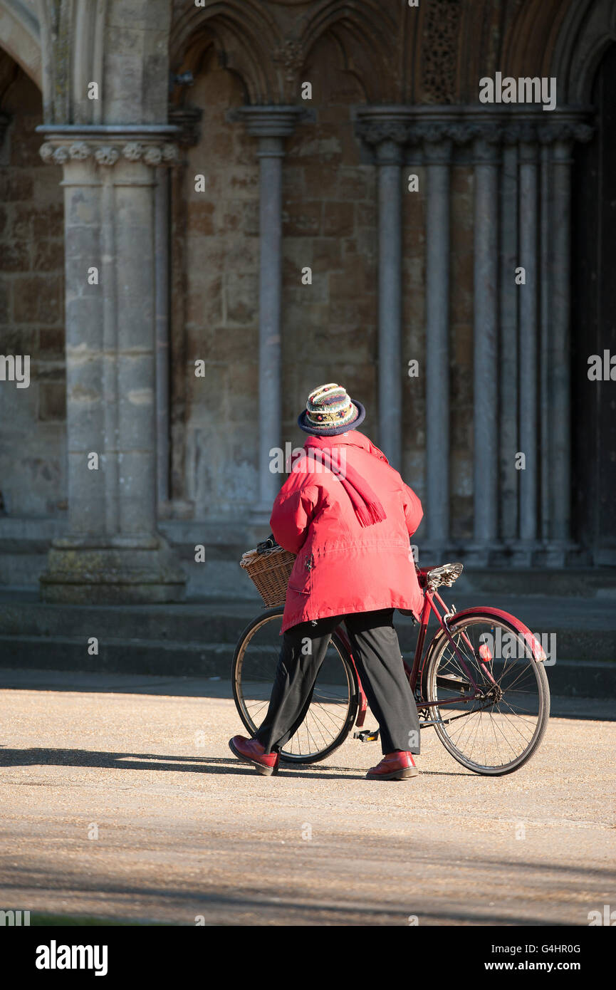 Lady pushing bicycle hi-res stock photography and images - Alamy
