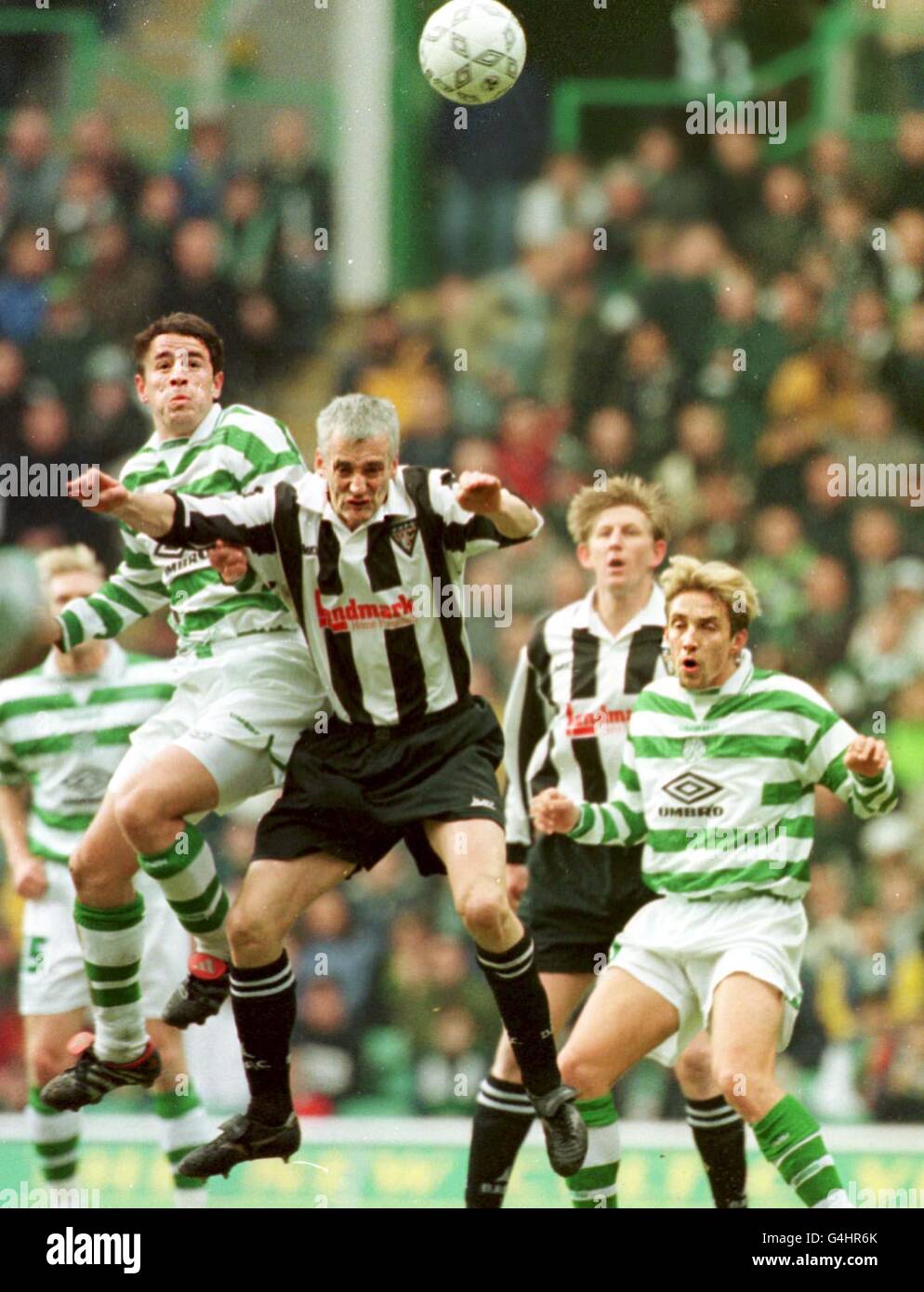 Dunfermline's Hamish French (centre) holds off Celtic's Phil O'Donnell ...