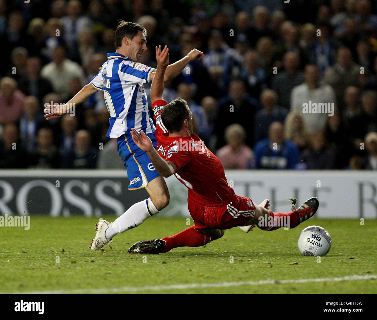 Brighton's Matt Sparrow has his shot stopped by Liverpool's Jamie ...