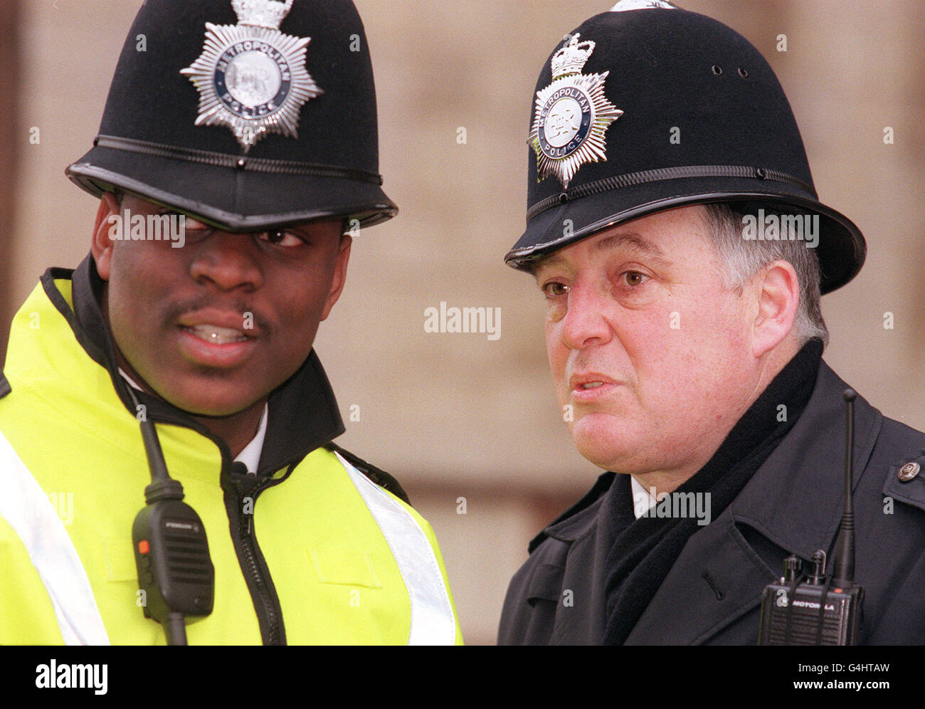 Two police officers stationed outside the House of Commons, where the ...
