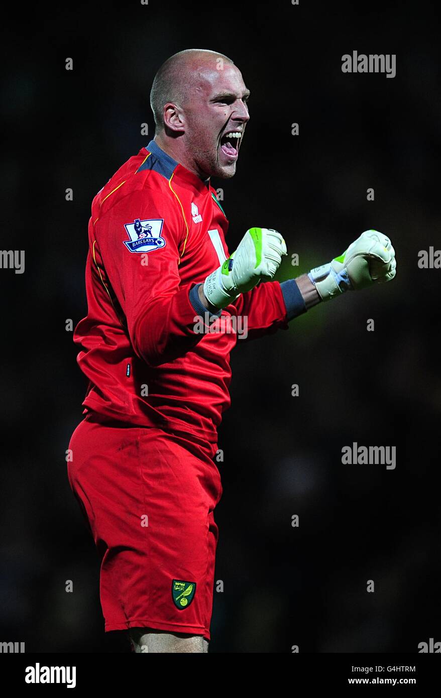 Norwich City goalkeeper John Ruddy celebrates after team mate Steve ...