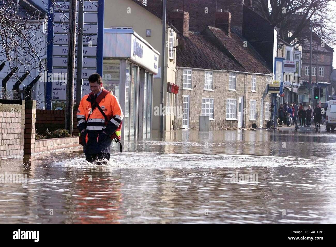Landscape flood water weather postman reflective jacket hand in ...