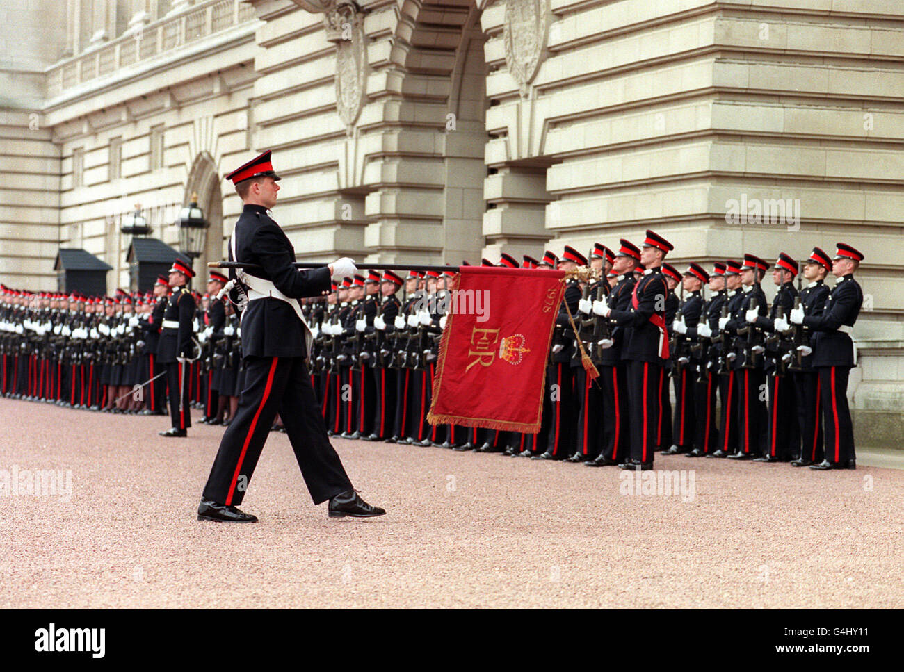 A Sandhurst Royal Military Academy cadet carries the new Sovereign's ...