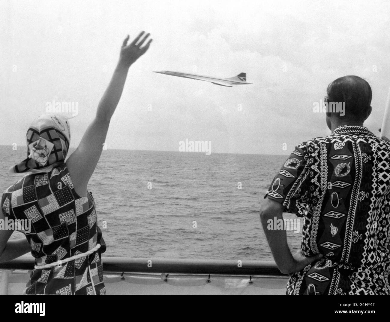 Queen Elizabeth II and the Duke of Edinburgh wave as Concorde flies by ...