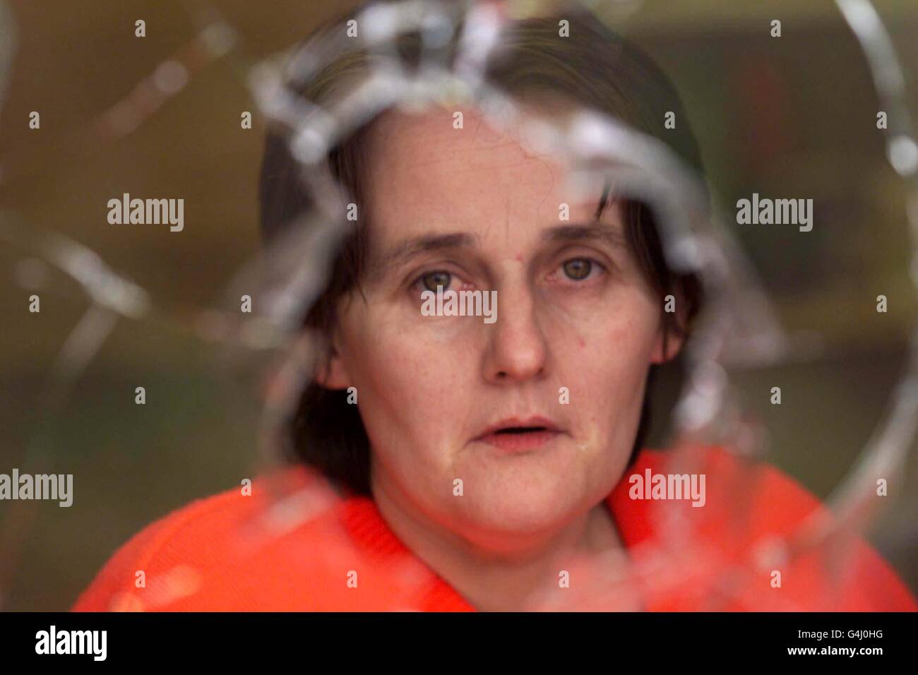 Pipe bomb woman: broken window Stock Photo - Alamy