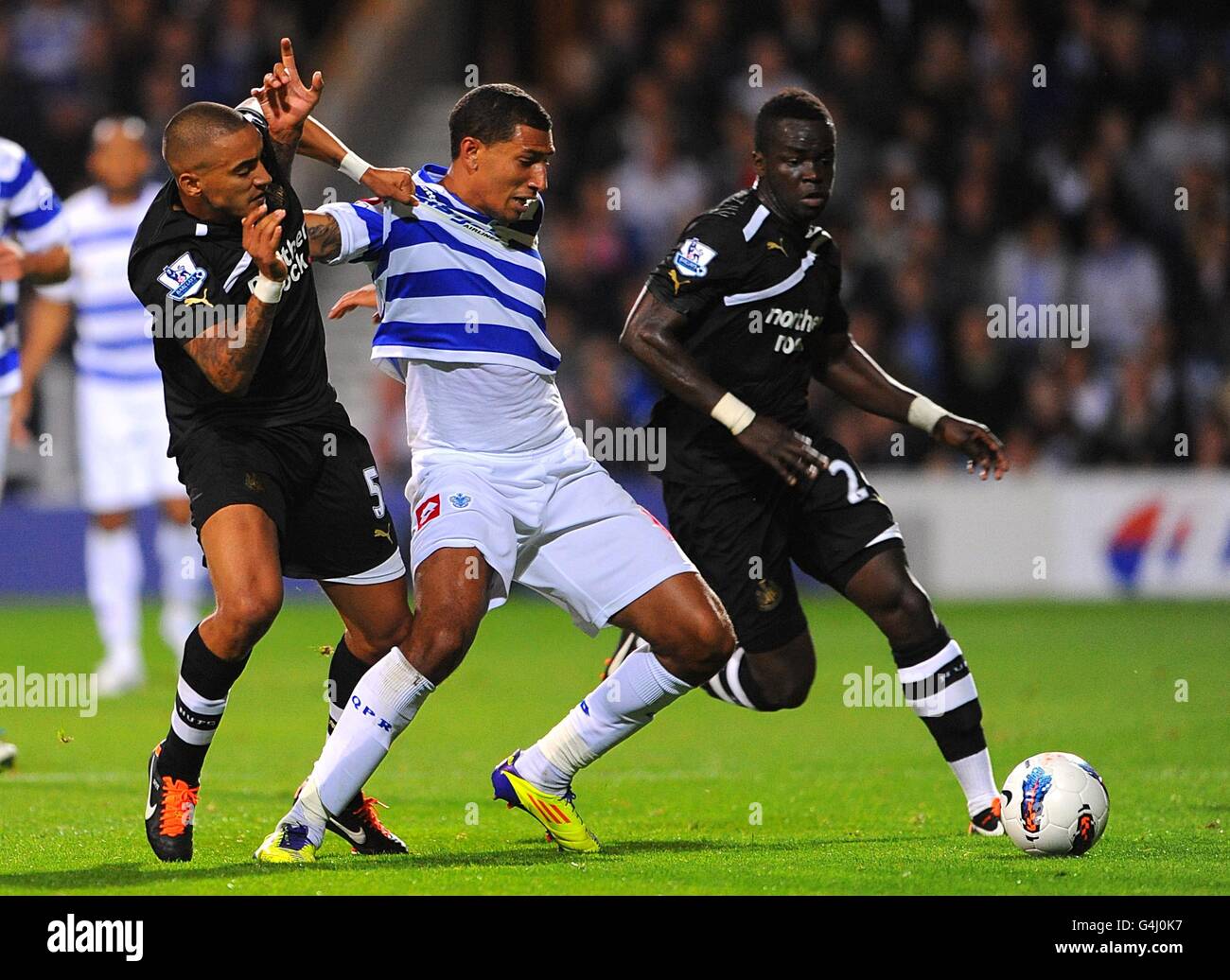 Queens Park Rangers' Jay Bothroyd battles for the ball with Newcastle ...