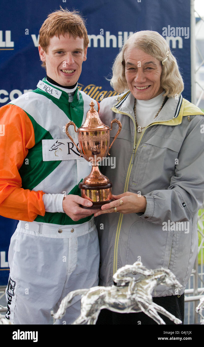 Barry McHugh (left) holds the Bronze Cup with horse owner Helen Steel ...