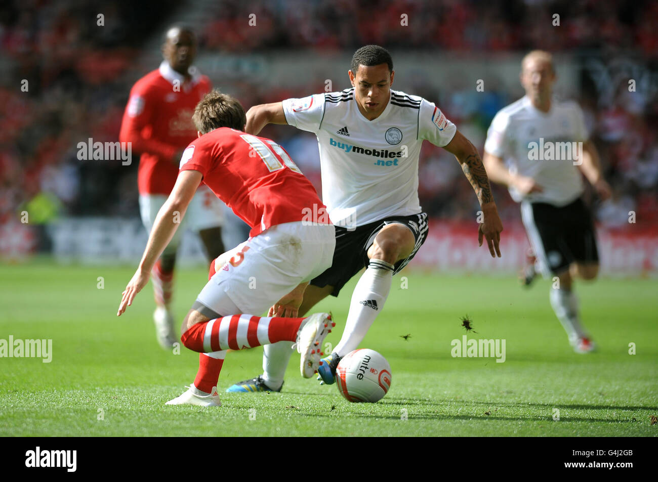 Nottingham Forest's Chris Gunter and Derby County's Nathan Tyson battle ...