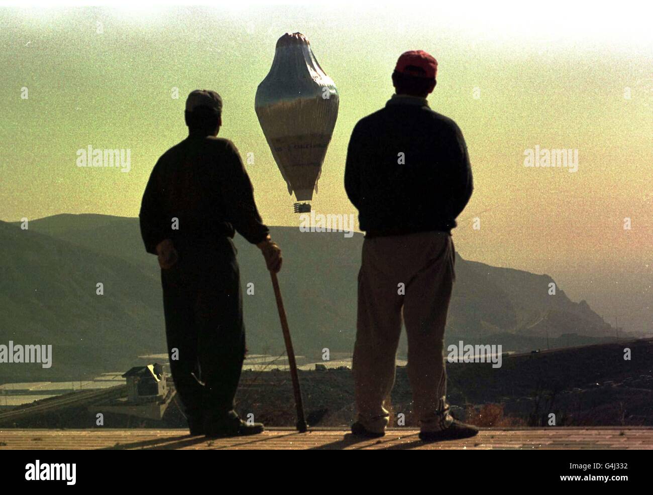 Two Spanish men watch the launch of The Cable and Wireless Round the ...
