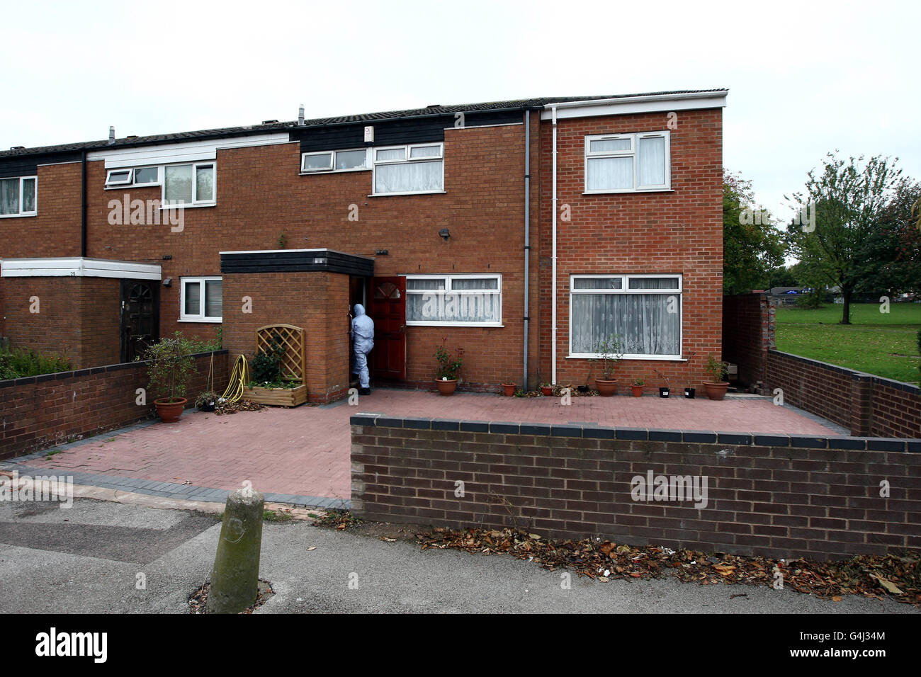 A Police Forensic Officer Enters A House On Turner Street Sparkbrook