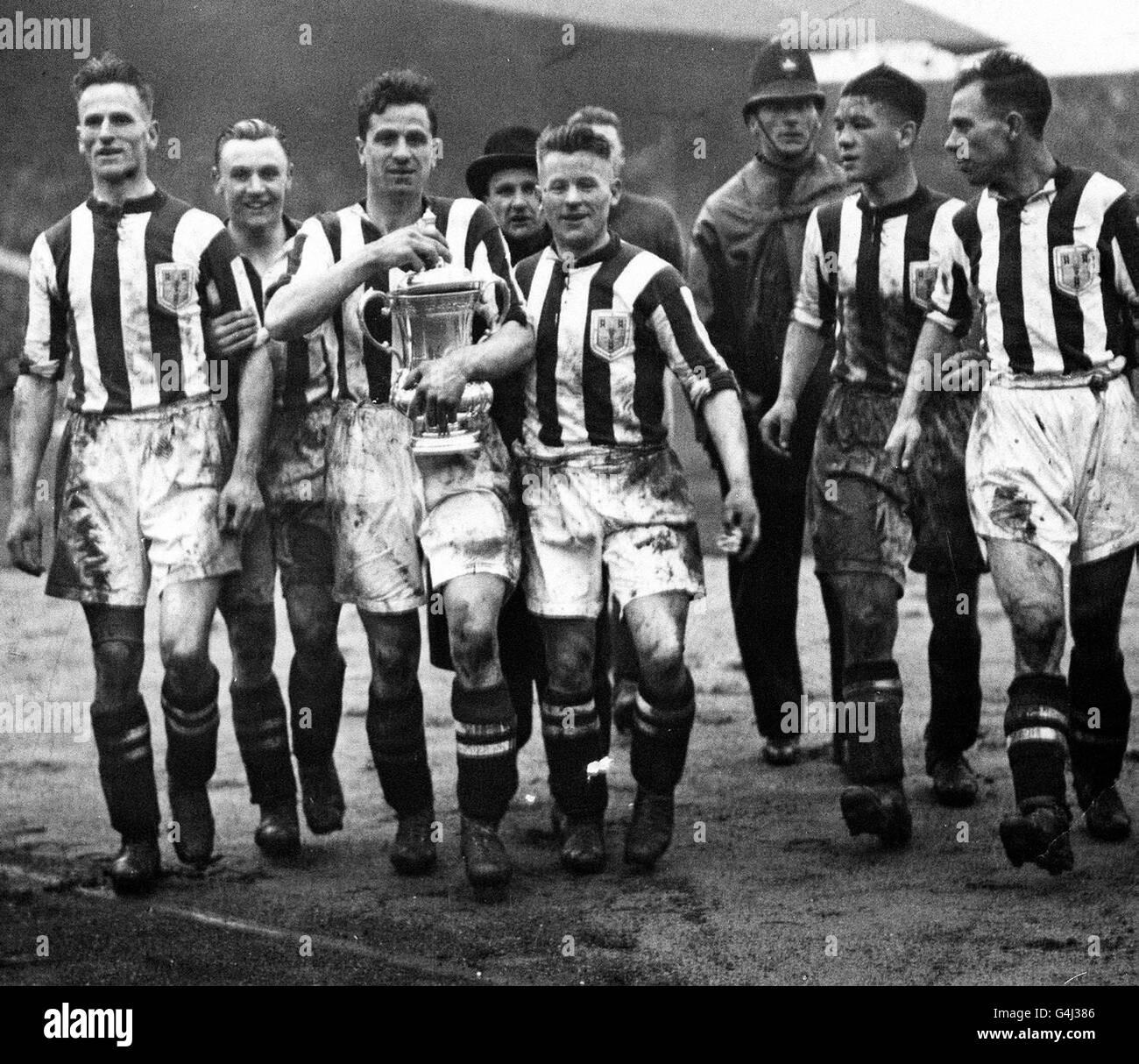 Glidden, carrying the F.A. Cup with his teammates after West Bromwich ...