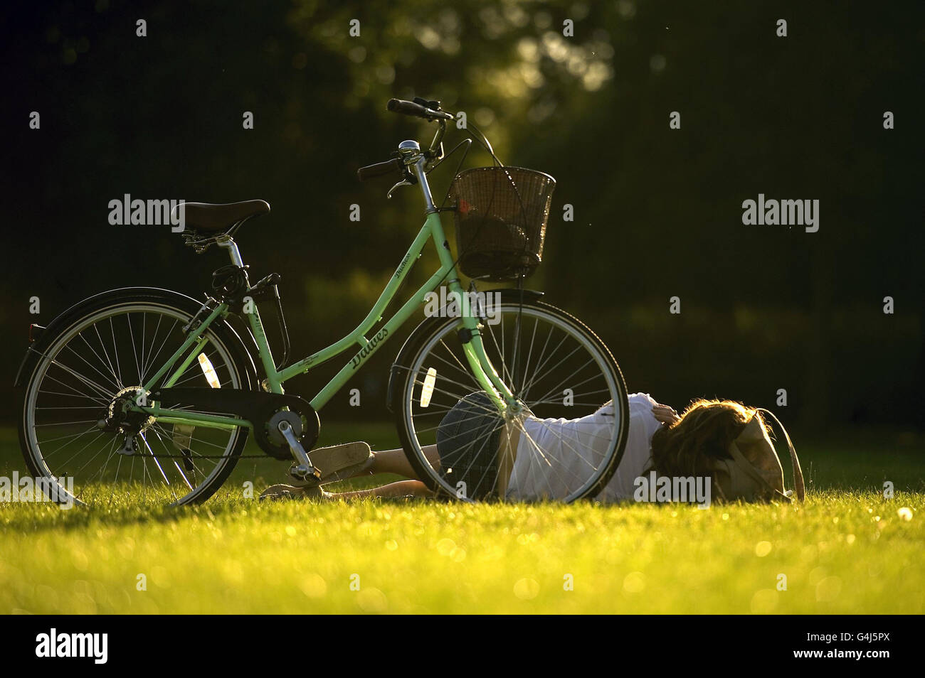 Caroline Millin relaxes in the warm evening sunshine on Clapham Common ...