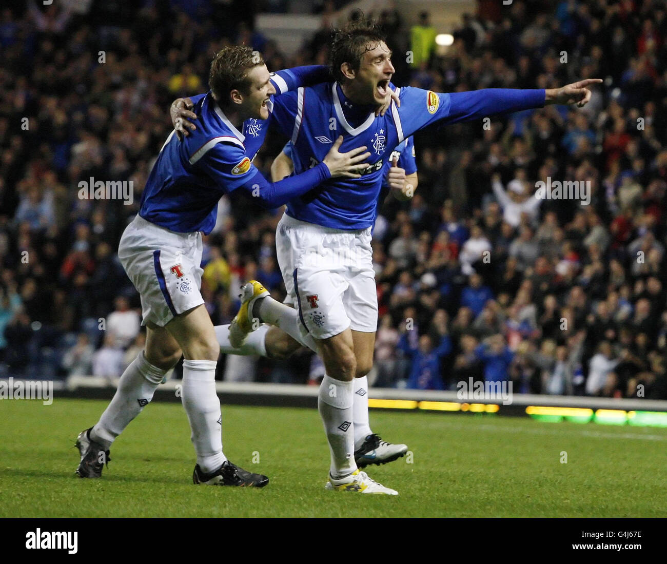 Rangers' Nikica Jelavic (right) celebrates his goal with team mate ...