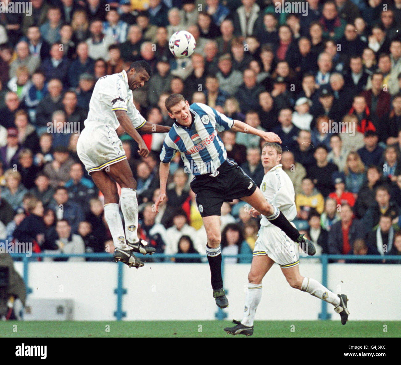 Radebe and Booth jump for ball Stock Photo - Alamy