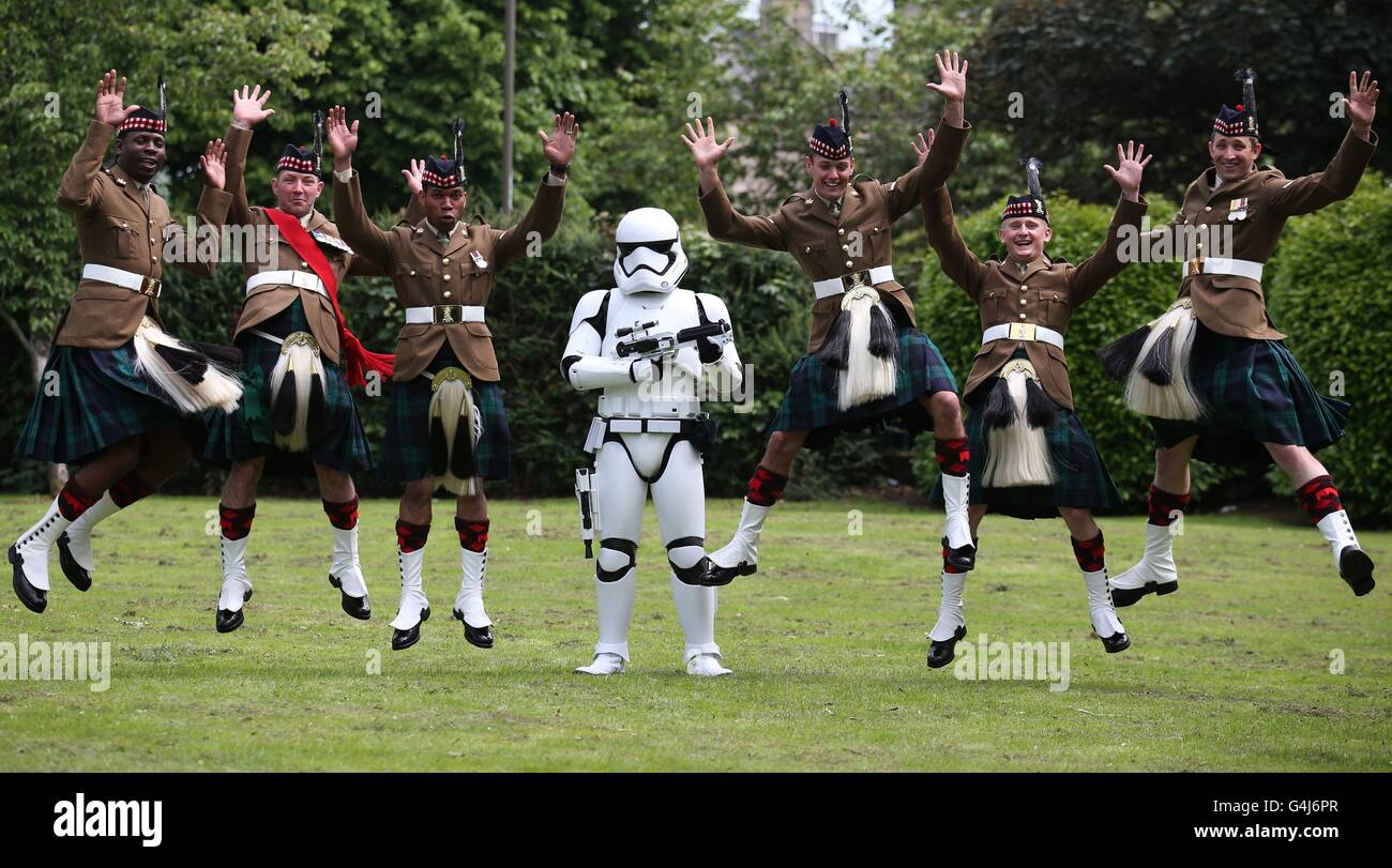 A stormtrooper poses with soldiers from 4 SCOTS Royal Regiment of ...