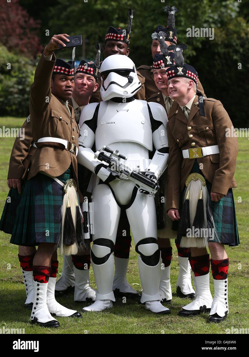 A stormtrooper takes a selfie with soldiers from 4 SCOTS Royal Regiment ...