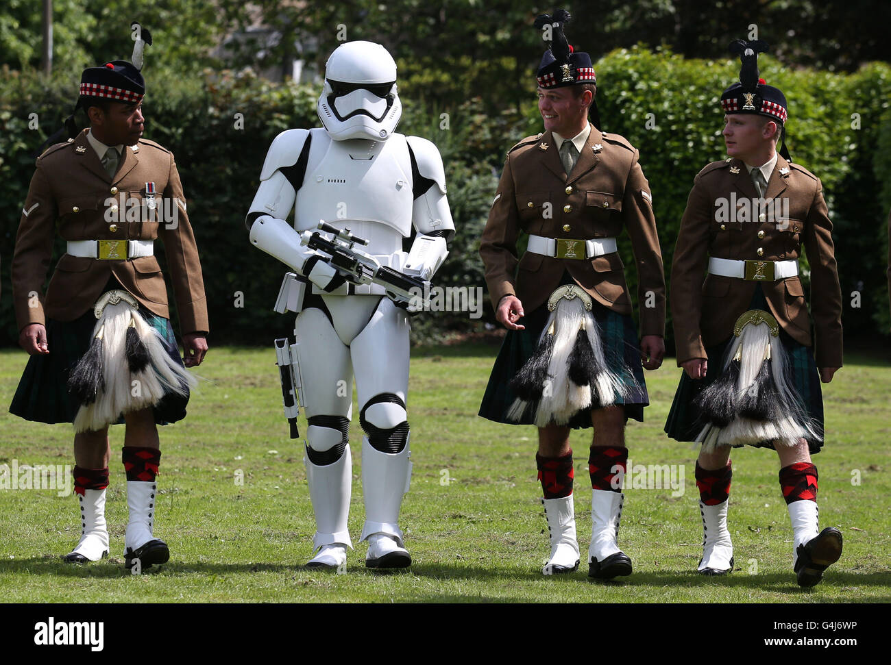 A stormtrooper walks with soldiers from 4 SCOTS Royal Regiment of ...
