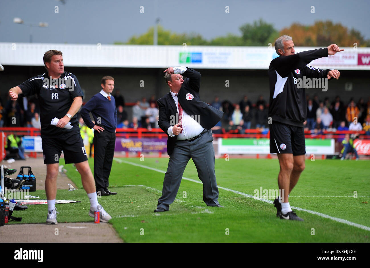 Crawley Town's Manager Steve Evans (centre), his assistant Paul Raynor ...