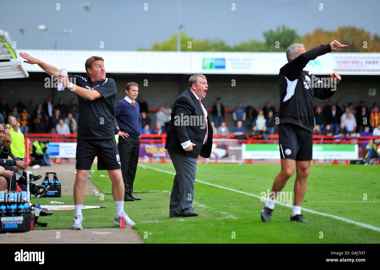 Crawley Town's Manager Steve Evans (centre), his assistant Paul Raynor ...