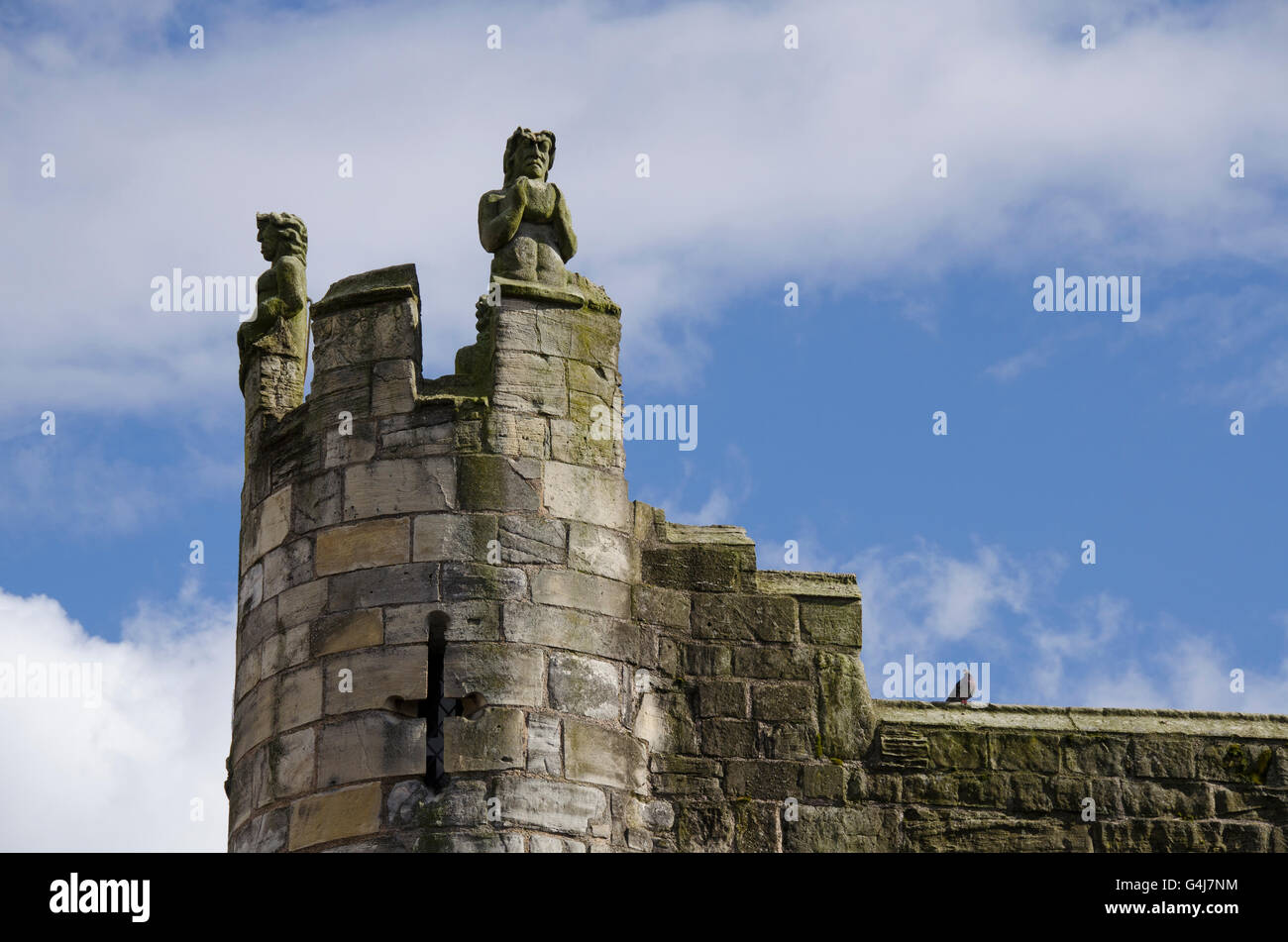 Close-up of stone carved figures on top of Monk Bar, an ancient ...