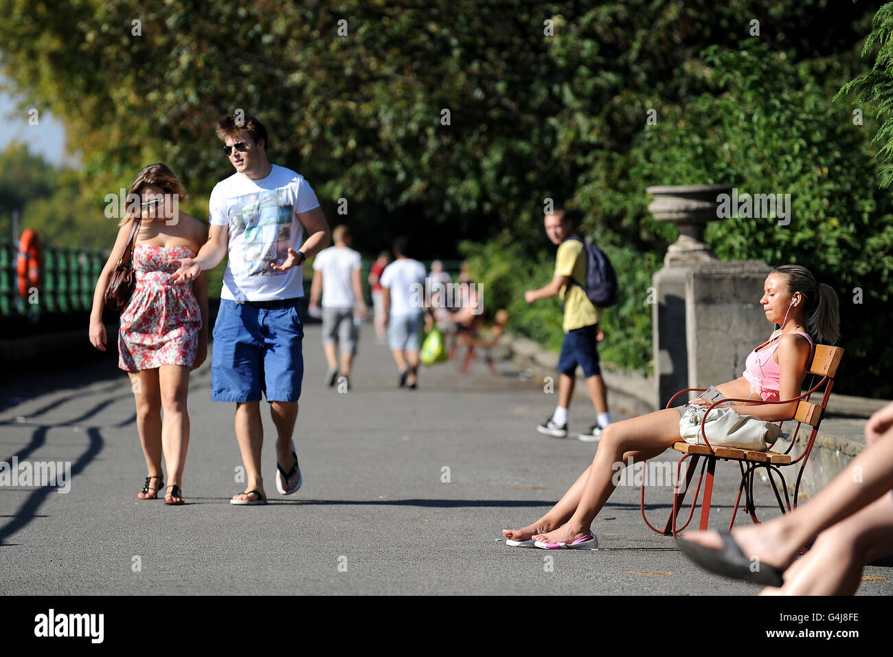People enjoy the sunny weather along the river in london hi-res stock ...