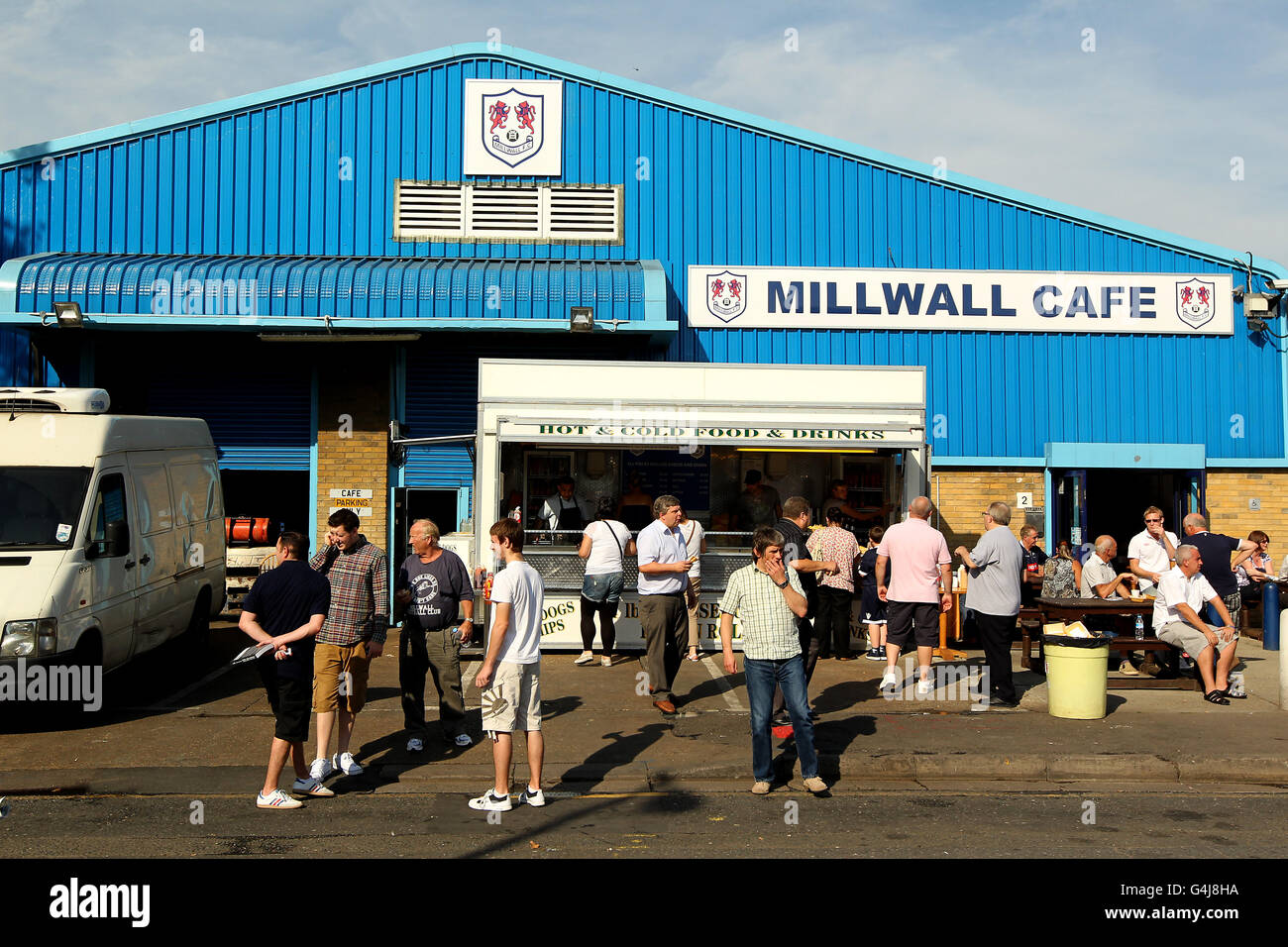 Fans enjoy refreshment at the Millwall Cafe outside the ground before ...